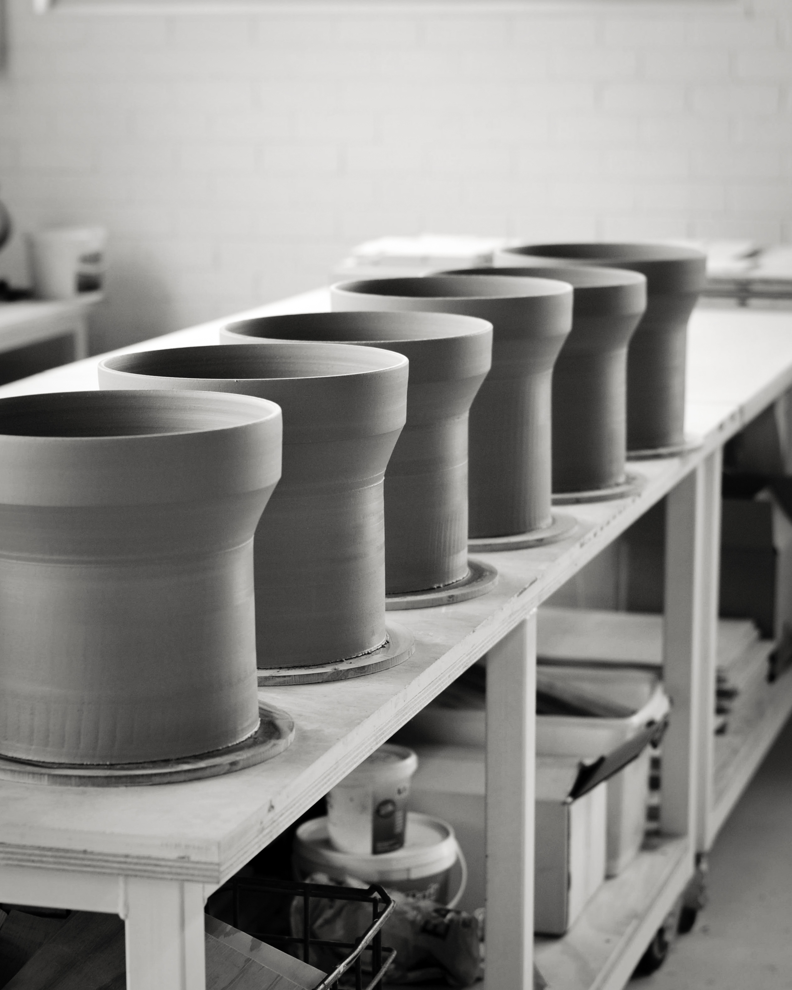 Funnel planters in olive green and in production.