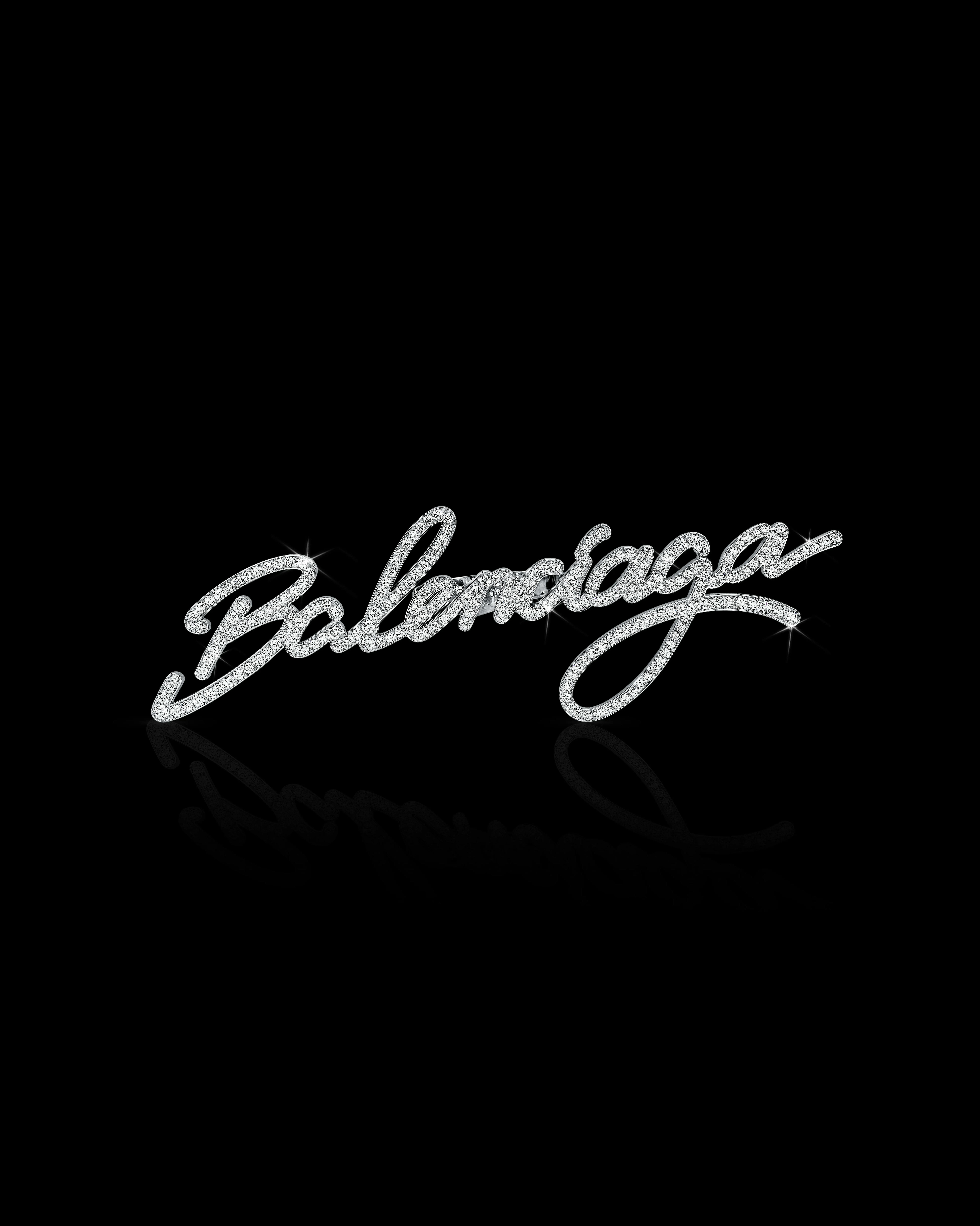 Image of a diamond-studded Balenciaga word written in cursive